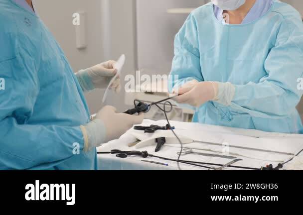 Part of surgical laparoscopic surgery in clinic. Nurse in operating ...