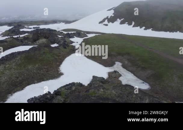 The magma stone field of Gorely volcano covered with fog. Kamchatka ...