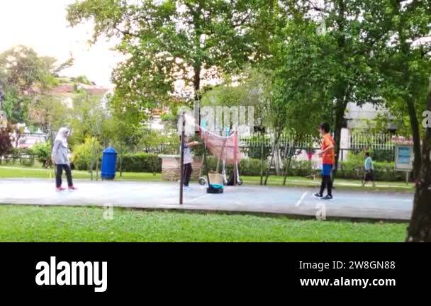 Park Playground With Young Asian People Playing Badminton Stock Video ...