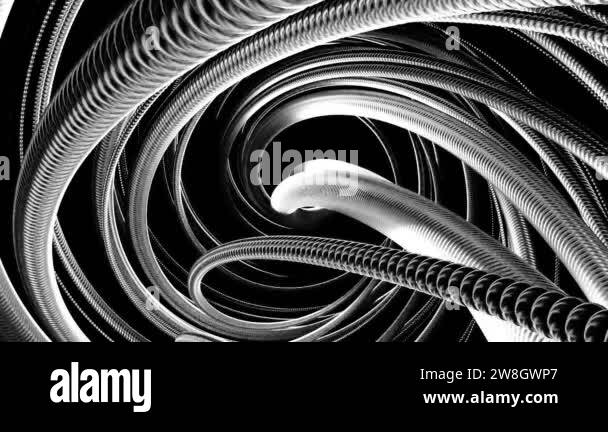 Twisted metal silver tube on a black background. Design. Metal tangle ...