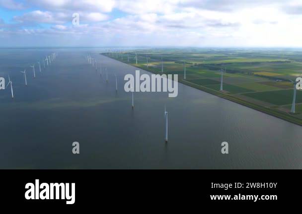 Wind turbines in the early morning, wind mill park in the Netherlands ...