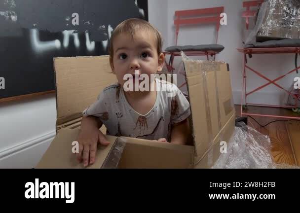 Big large cardboard box package stands on floor in interior of living ...
