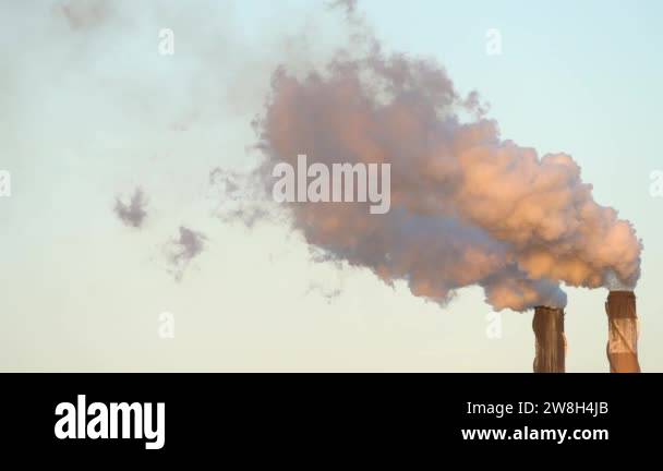 Smoke clouds polluting the atmosphere during crushing season at an ...