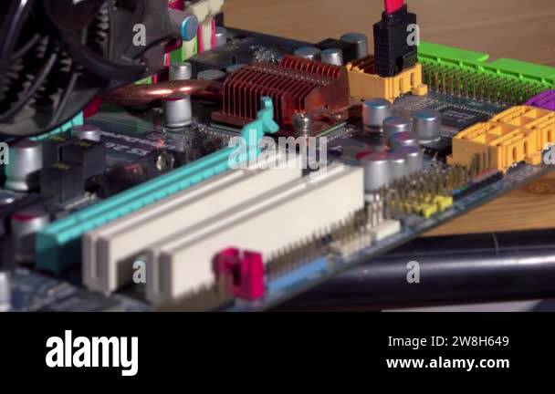 Assembling high performance personal computer, inserting hardware into the motherboard socket ...