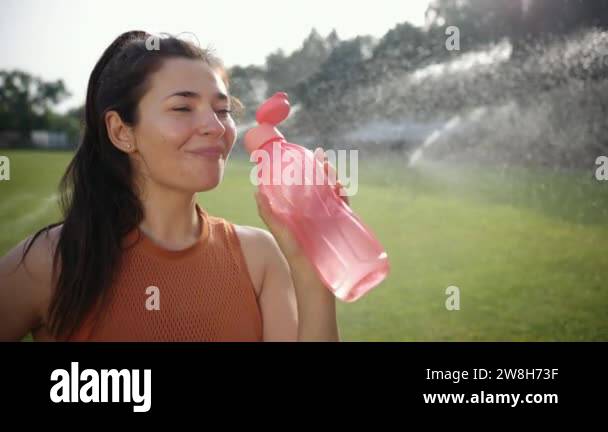Woman drinking water Stock Videos & Footage - HD and 4K Video Clips - Alamy