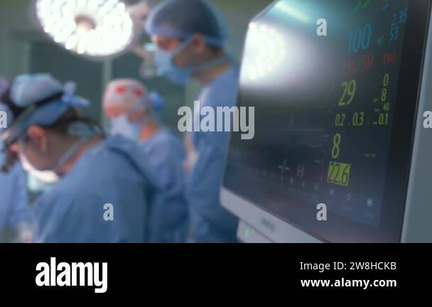Heart rate and patient control monitor in hospital theater room during ...