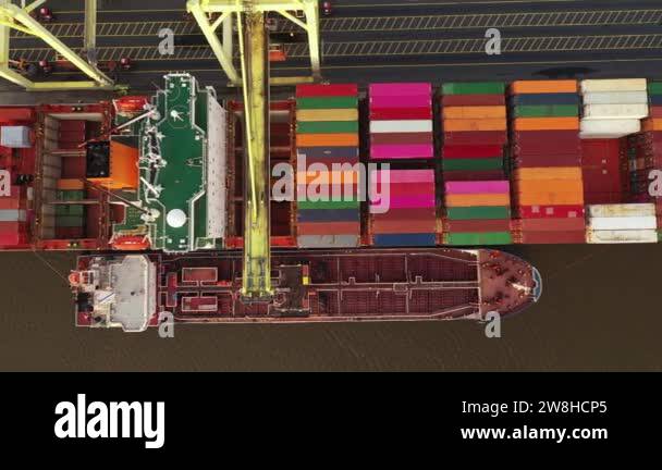 Container ship at pier. Top-down view. Unloading vessel. Bunkering ...