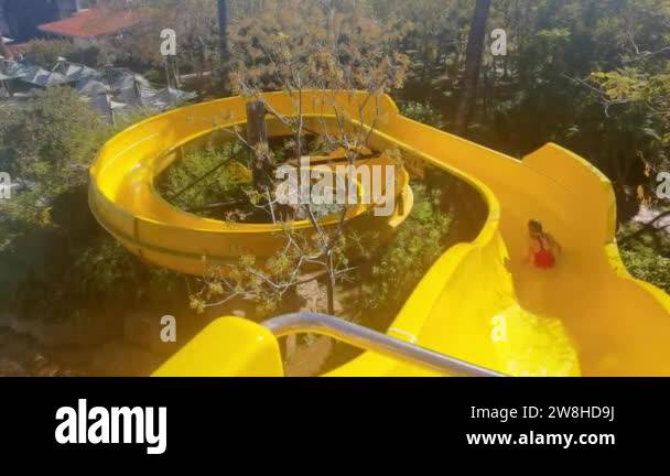 Girl Having Fun On Water Slides Aqua Park Glides. Funny Ride On Water ...
