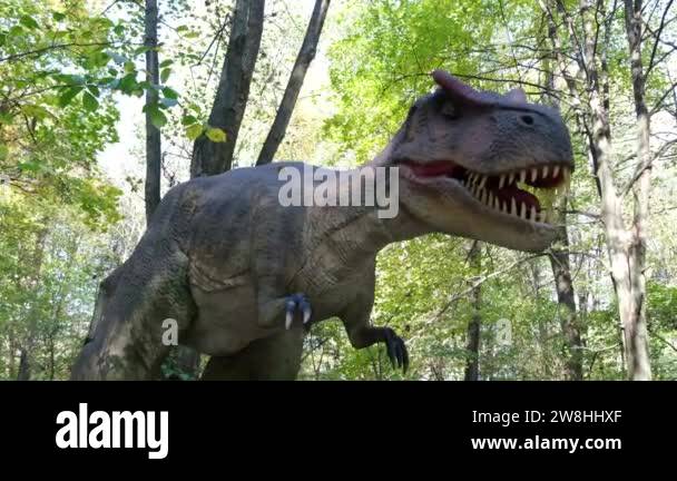 Dinosaur in the forest, at dino park. Life-size dinosaurs in the park ...