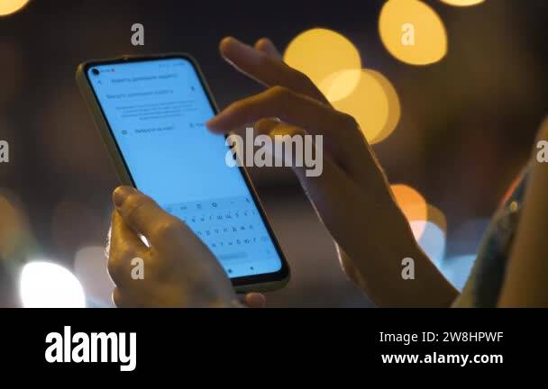 Close up of female hands holding cellphone with Google maps navigation ...