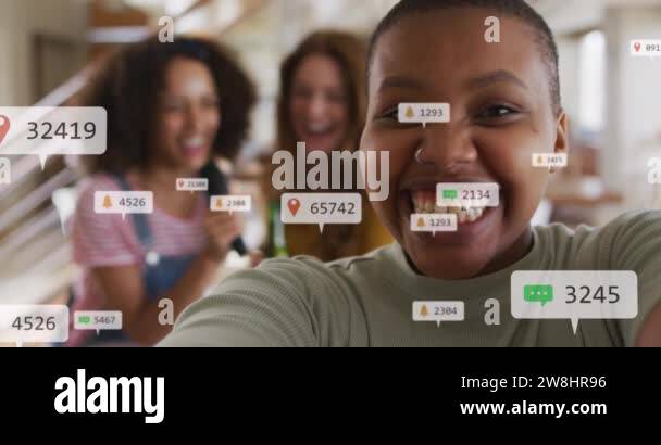 Animation of social media icons and text over happy female friends ...