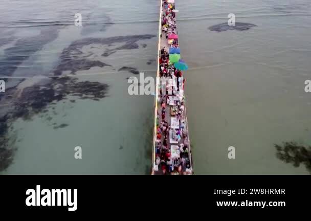 Crowd of people on the pier, people came to the fair on the pier in ...