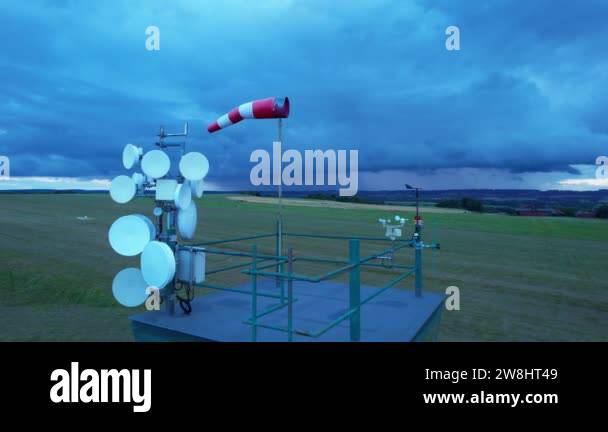 Anemometer and windsock on the tower to measure the direction and speed ...