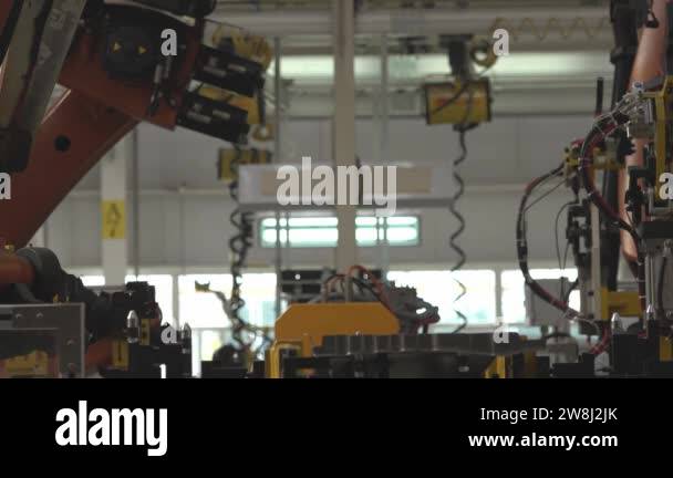 Body of car on conveyor. Modern Assembly of cars at the plant. The automated build process. The ...