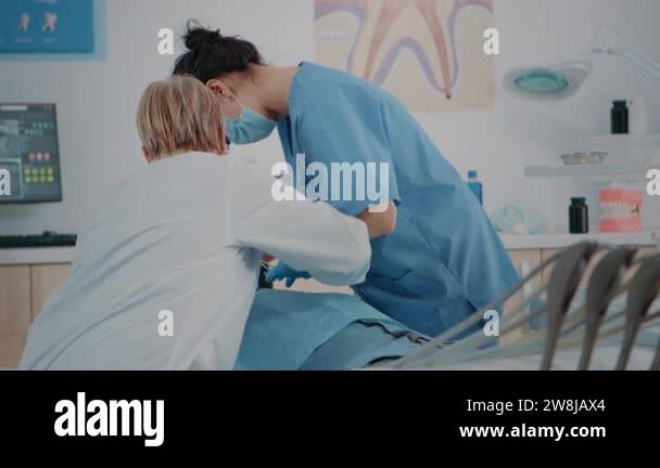 Dentistry team doing teeth extraction Stock Videos & Footage - HD and ...