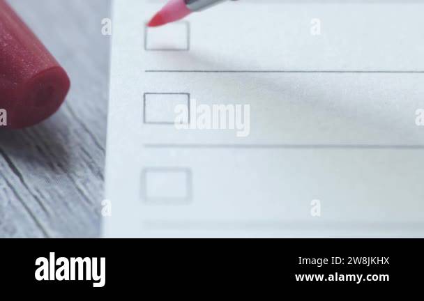 check mark on a check box on a paper Stock Video Footage - Alamy