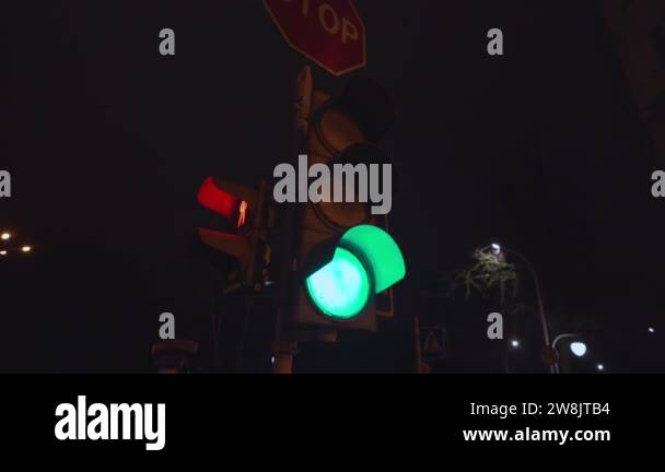 Traffic light for vehicles and pedestrians and stop sign hanging on ...