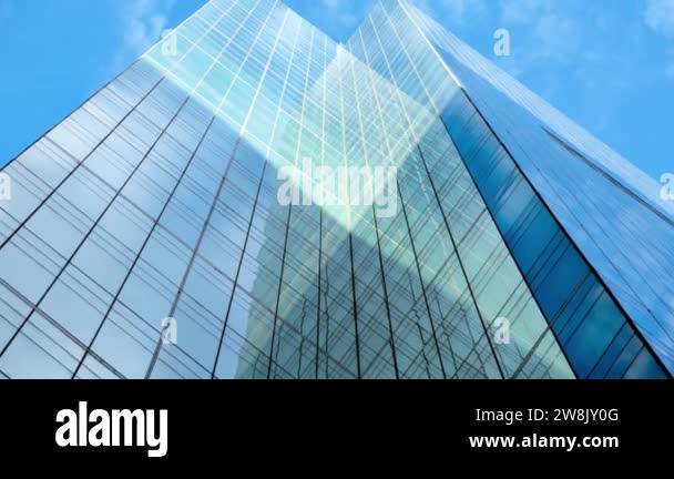 Camera panning up a tall office building with glass facade Stock Video ...