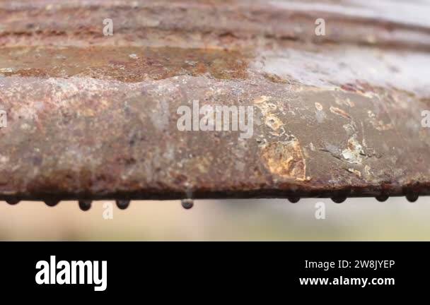 Rain drops on rusty bronze surface of ancient church bell, cultural ...