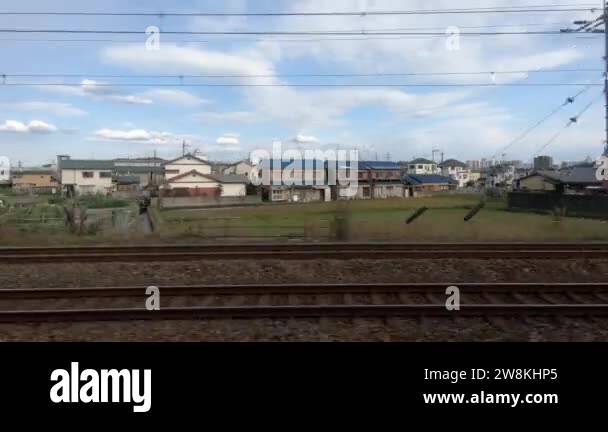 Cityscape view through the window from train travels in the city during ...