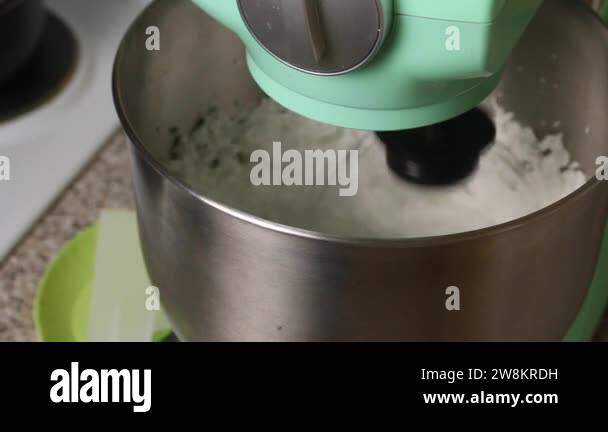 The planetary mixer mixes the marshmallow mass. Cooking marshmallow ...