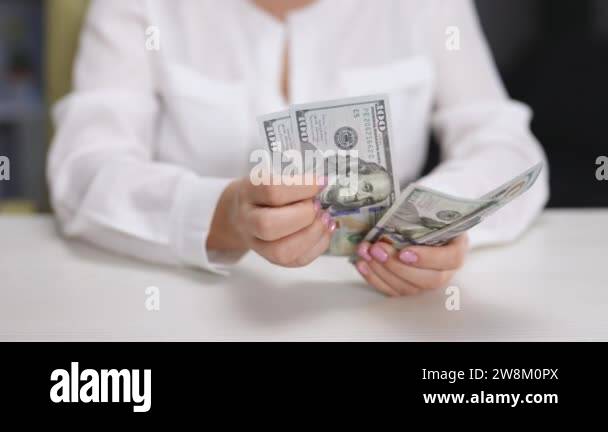 Woman counting dollar bills. Close up of female hands count money cash ...