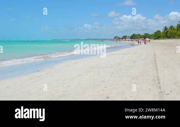 Walking at a Maragogi beach, known as the Brazilian caribbean. Barra ...