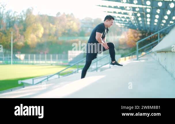 young asian runner athlete with muscle pain. Man massaging Stretching ...