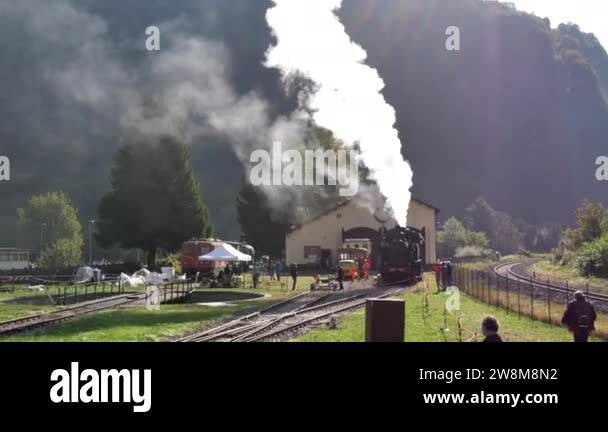 Steam locomotive train stand in railway station and blow steam Stock ...