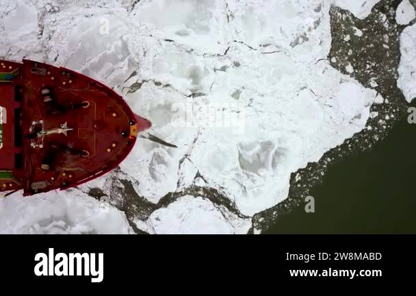 Drone top down Epic red steel icebreaker ship tanker breaks winter ...