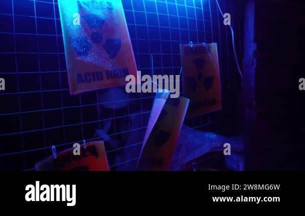 Cyberpunk future concept. Fence with signs warning about acid rain in ...