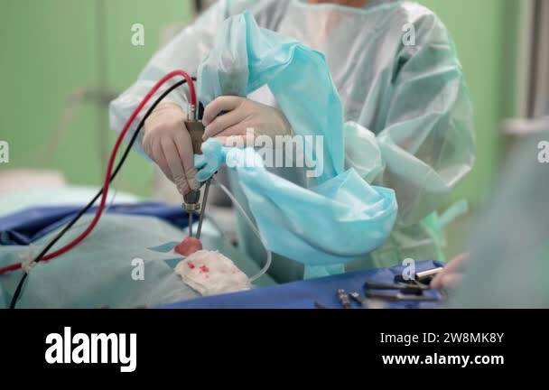 inside operating room of otolaryngology clinic, surgeon is performing ...
