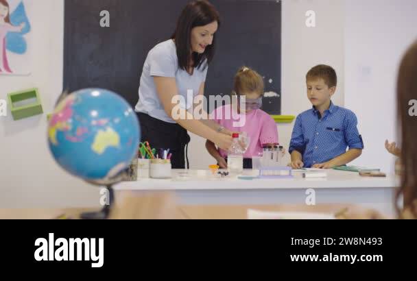 Elementary School Science Classroom: Enthusiastic Teacher Explains ...