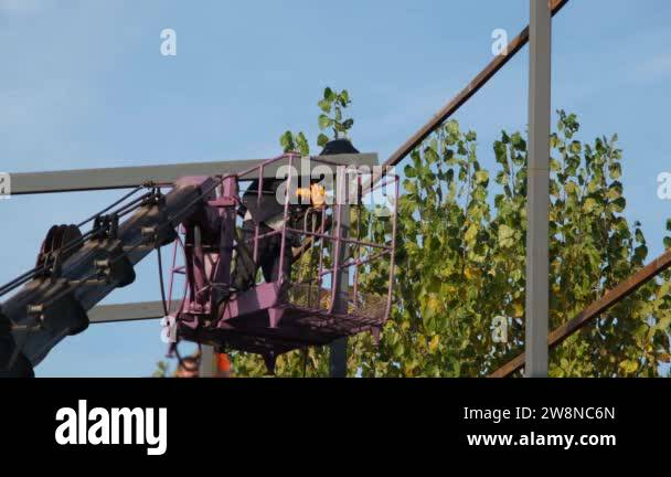 steel construction, worker tying wire rope in steel construction on ...