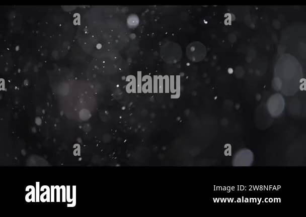 Floating abstract dust particle light bokeh on dark background with selective focus. Natural ...