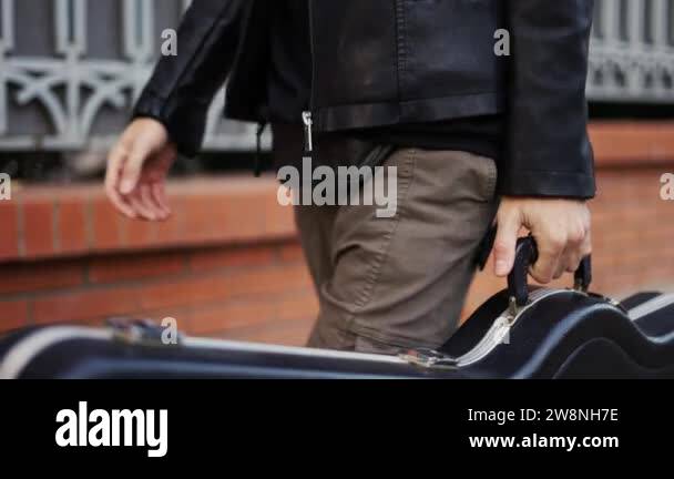 Man carrying his guitar Stock Videos & Footage - HD and 4K Video Clips ...