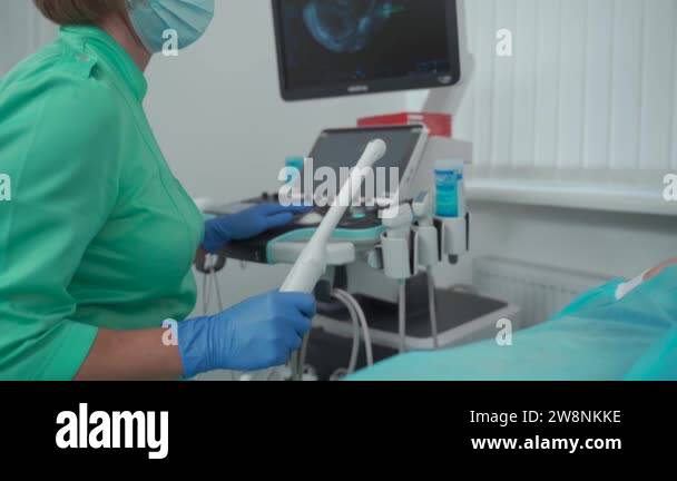 Gynecologist office. Female doctor operating ultrasound scanner ...