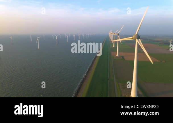 Wind turbines in the early morning, wind mill park in the Netherlands ...