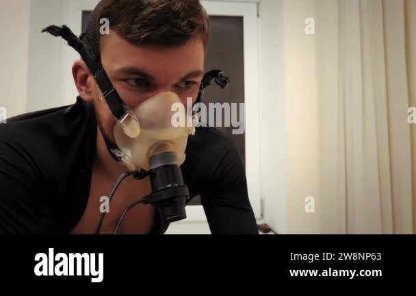 Triathlete doing Vo2 Max test in modern sport science lab. Examining ...