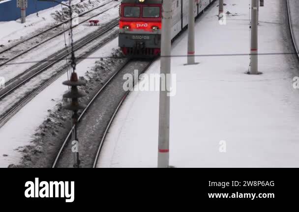 Ufa, Russia, 16 February 2020: An electro-diesel locomotive pulls a ...