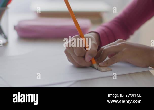 Geometry task. Close up shot of unrecognizable black girl drawing ...