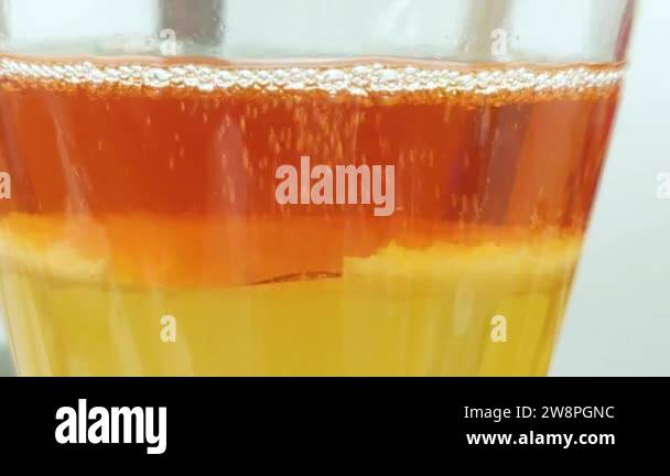 Separation of organic layer and water layer in separating funnel in a ...