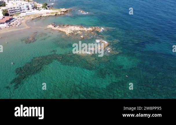 Aerial video view from drone on underwater reefs and coastal rocks in ...