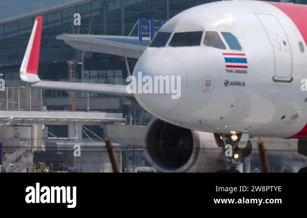 Airbus A320 AirAsia front view Stock Video Footage - Alamy