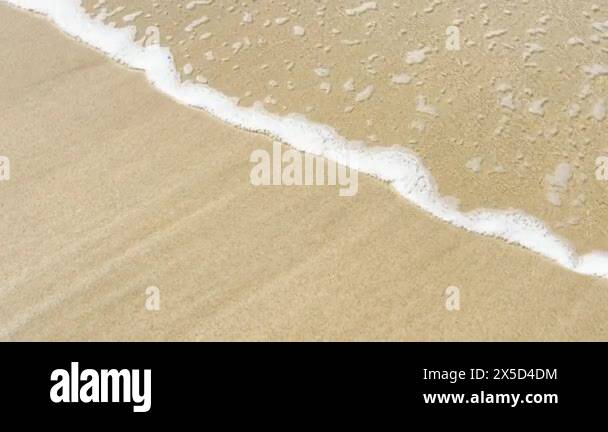 Shallow water on Atlantic ocean beach. Yellow sand and transparent sea ...