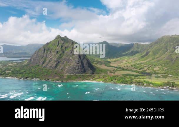 Experience an aerial perspective of Kualoa, a tropical island located ...