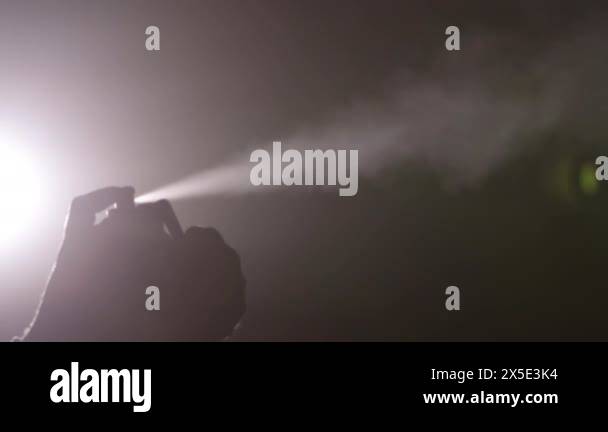 Flame art, Fire creation, Flame control. Shadowed figure in murky ...