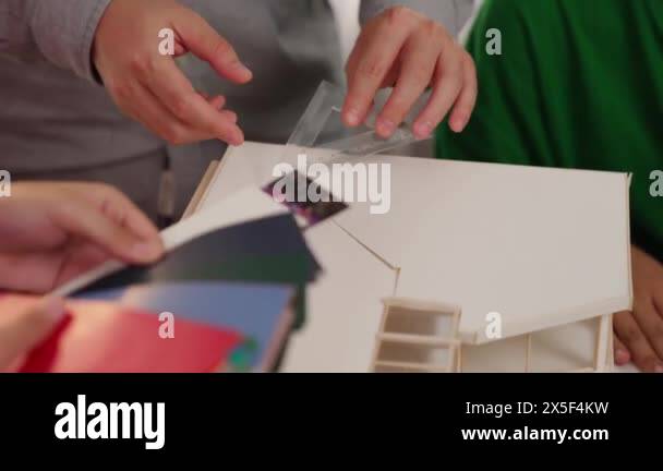 Slow motion home designer using architectural equipment draw a ...