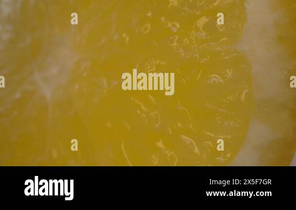 The macro photography of a sliced orange with vibrant orange color and ...