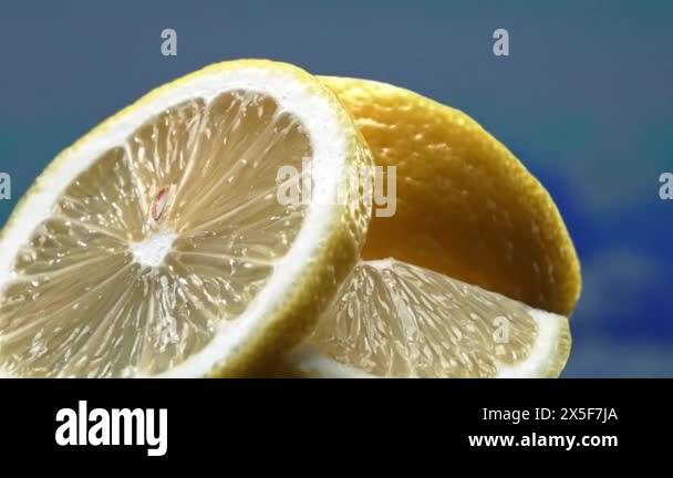 A slice of fresh lemon, bright yellow and vibrantly citric, lies ...